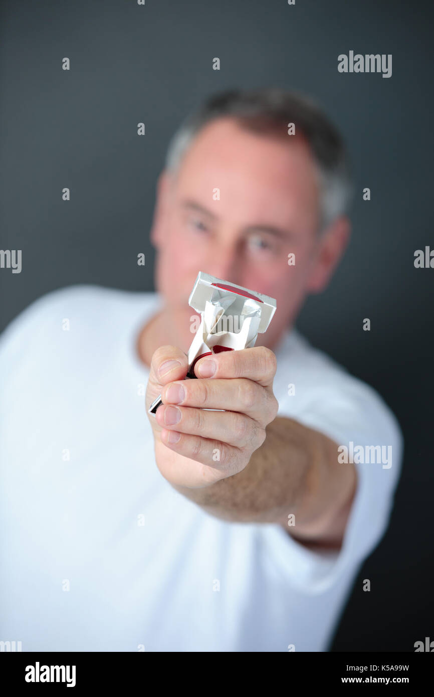 man crushing a packet of cigarettes stop smoking concept Stock Photo ...