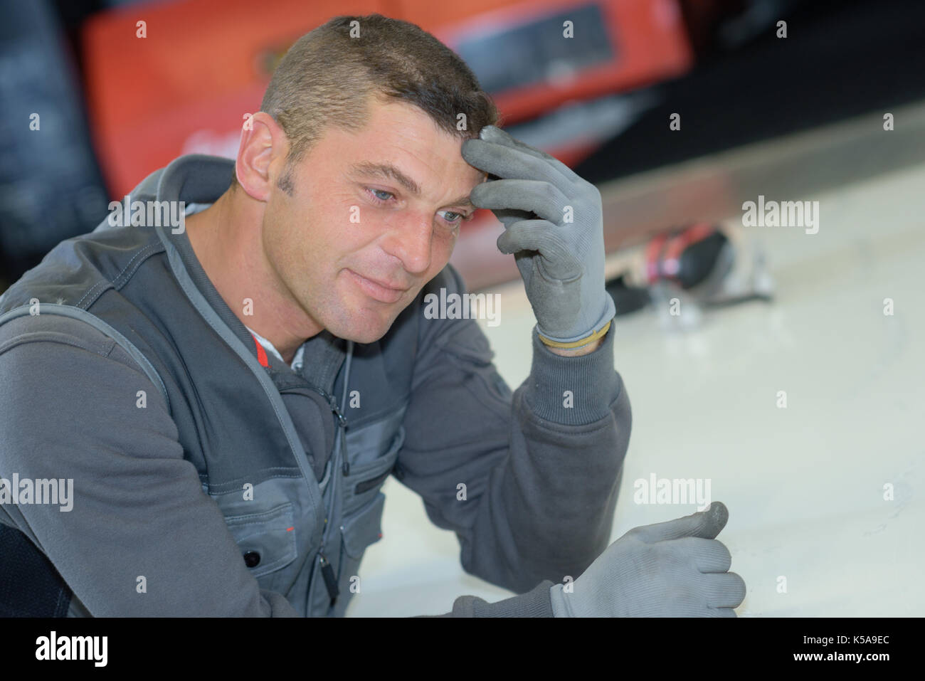 portrait of a male mechanic smiling Stock Photo - Alamy