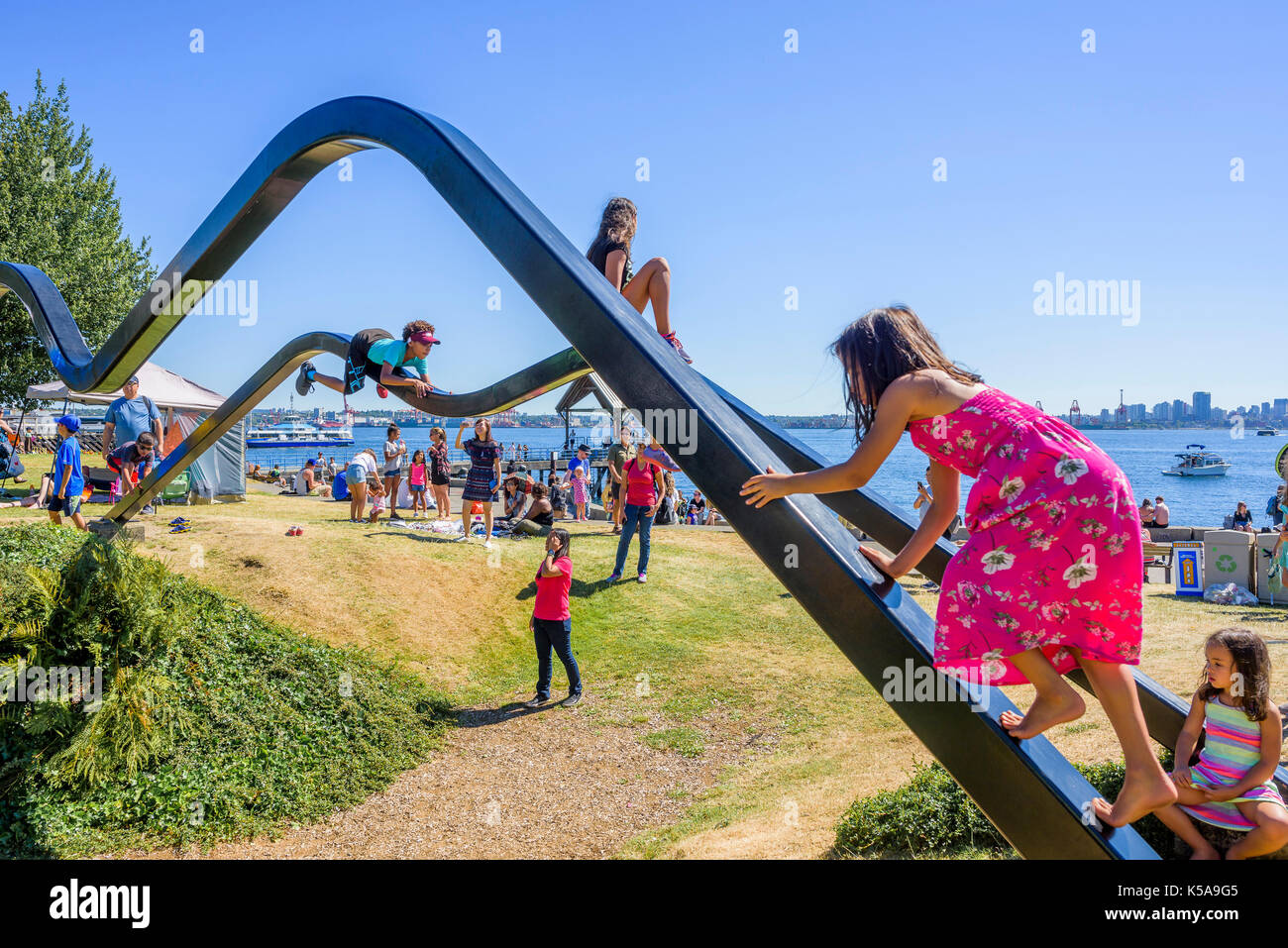 Kids playing on sculpture, Waterfront Park, North Vancouver, British ...