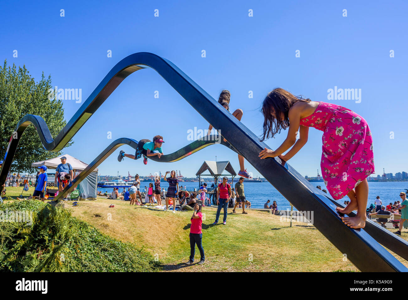 Kids playing on sculpture, Waterfront Park, North Vancouver, British ...