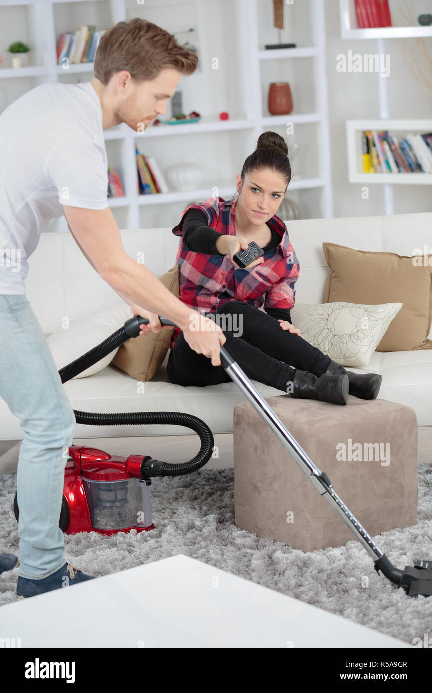Adult man doing housework vacuum hi-res stock photography and images ...