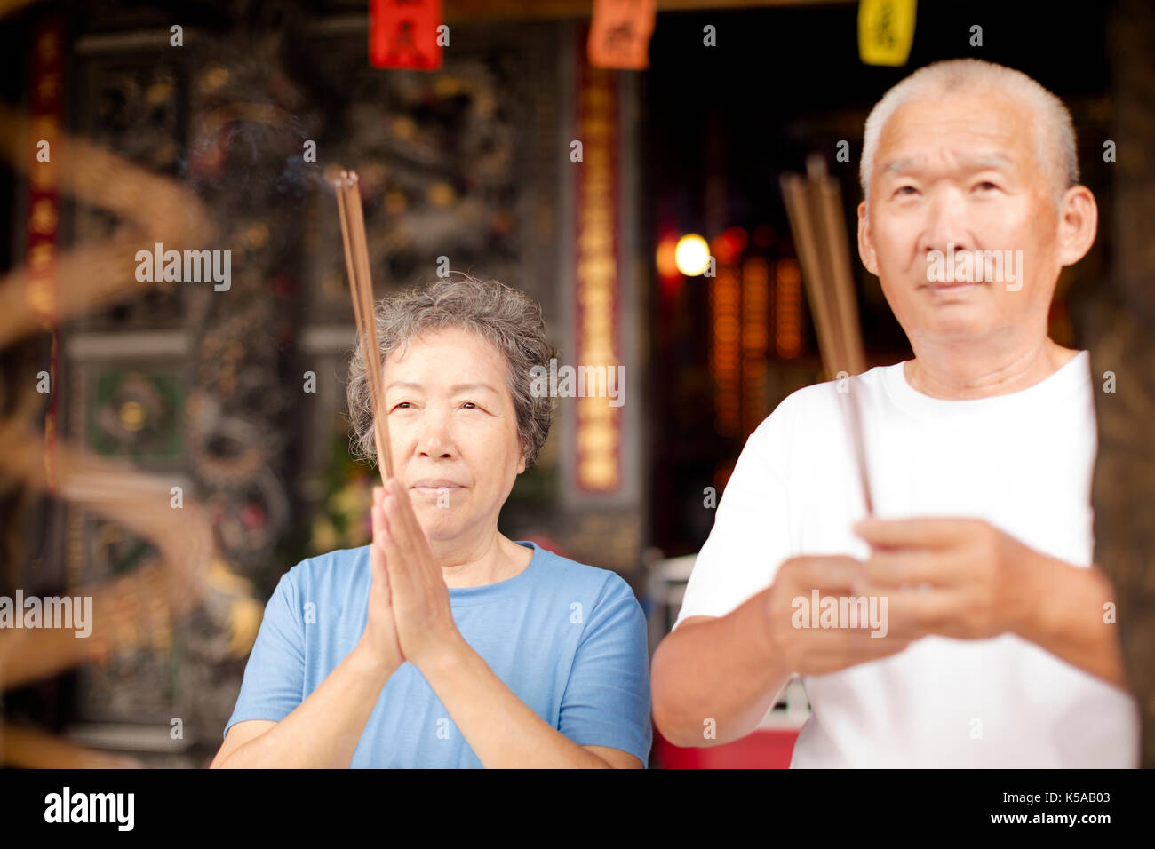 Praying joss stick hi-res stock photography and images - Alamy