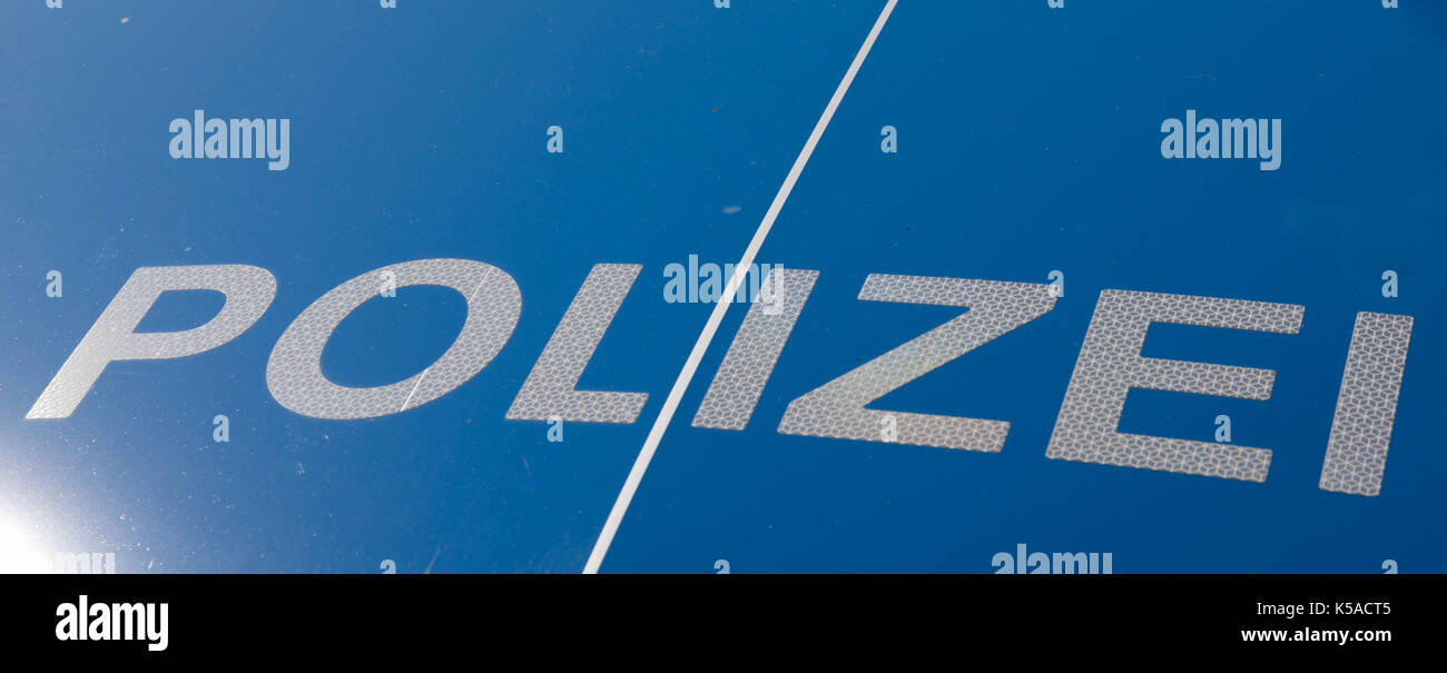 German police sign on a patrol car - Polizei Stock Photo - Alamy
