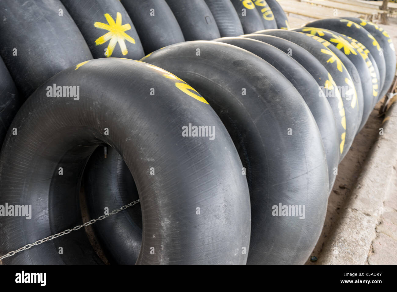 Group of black inflatable ring at the beach in Thailand Stock Photo - Alamy