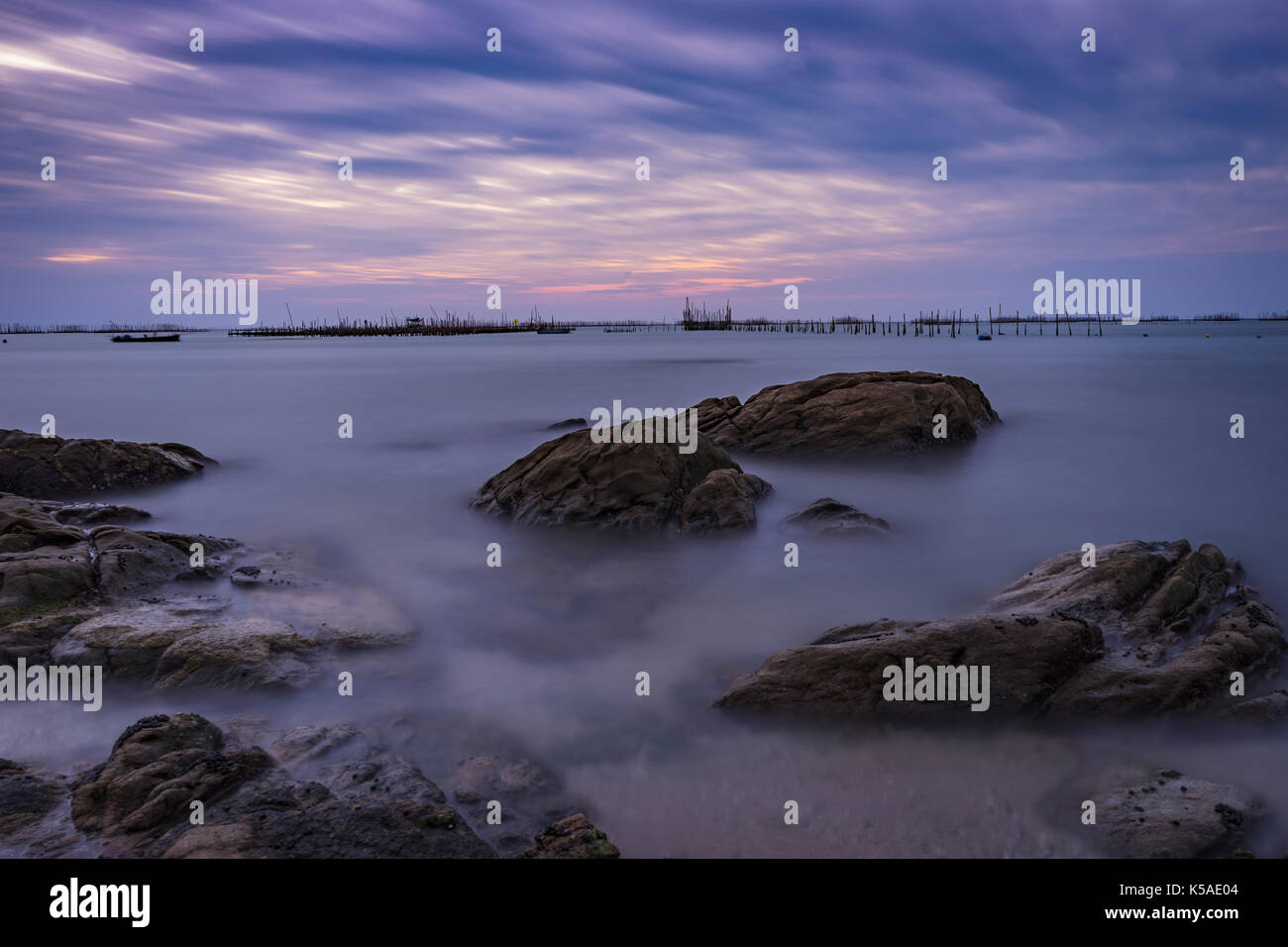 Ocean at sunset time in Thailand, slow shutter speed give a beautiful ...