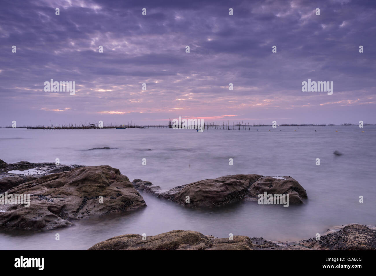 Ocean at sunset time in Thailand, slow shutter speed give a beautiful ...