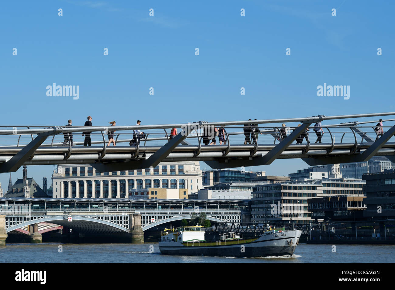 Crowd people crossing millenium bridge hi-res stock photography and ...