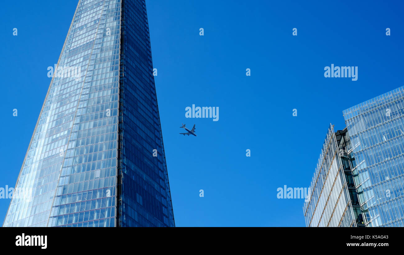 Plane flying the shard hi-res stock photography and images - Alamy