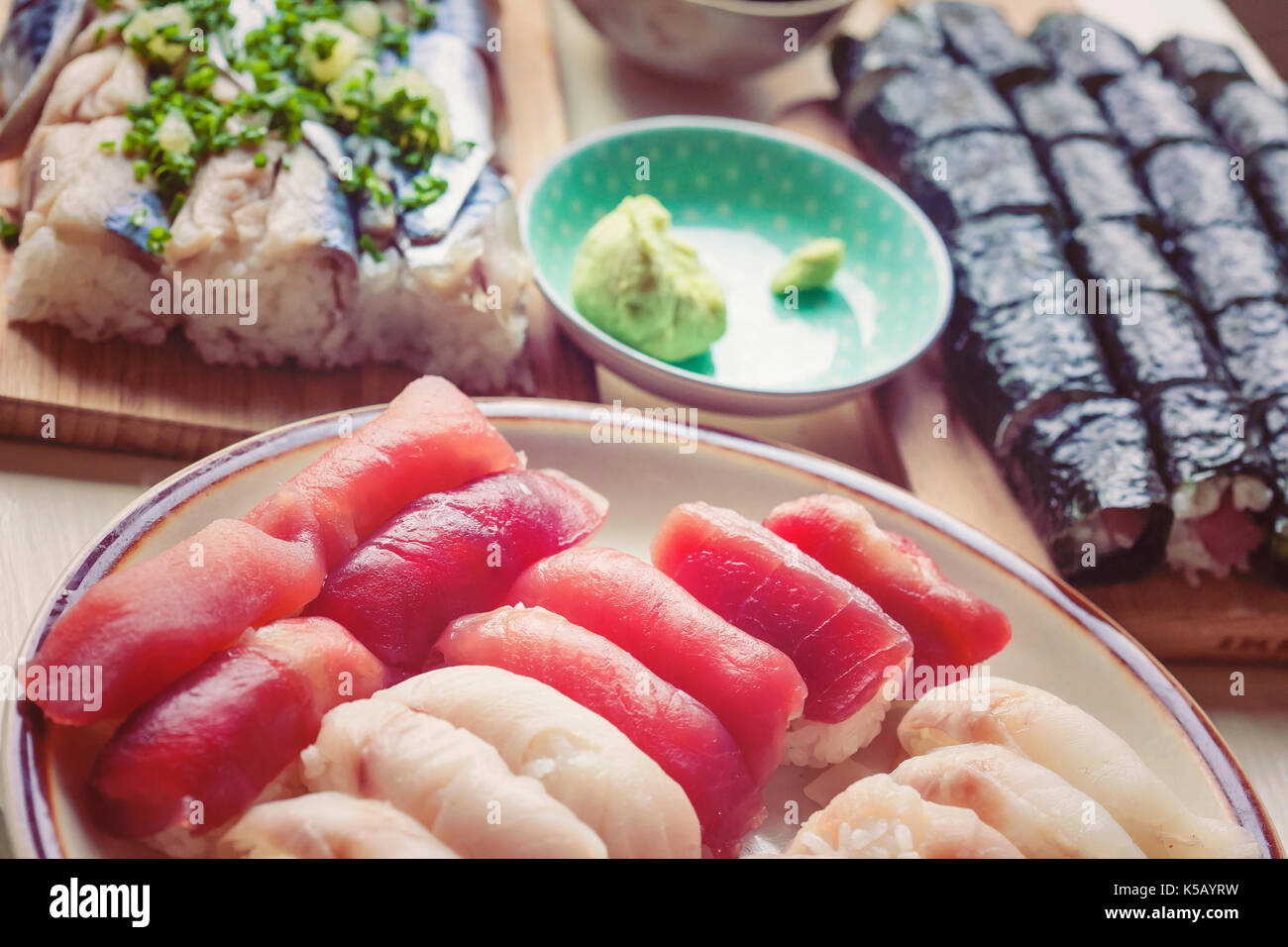 Kitchen table with Japanese sushi Stock Photo - Alamy