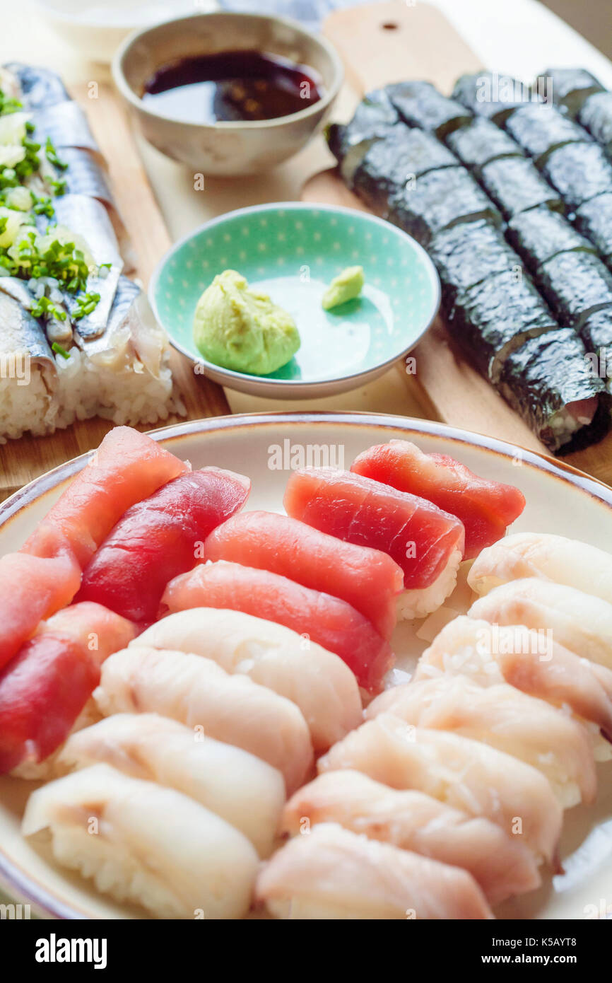 Kitchen table with Japanese sushi Stock Photo - Alamy