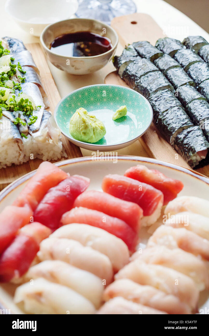 Kitchen table with Japanese sushi Stock Photo - Alamy