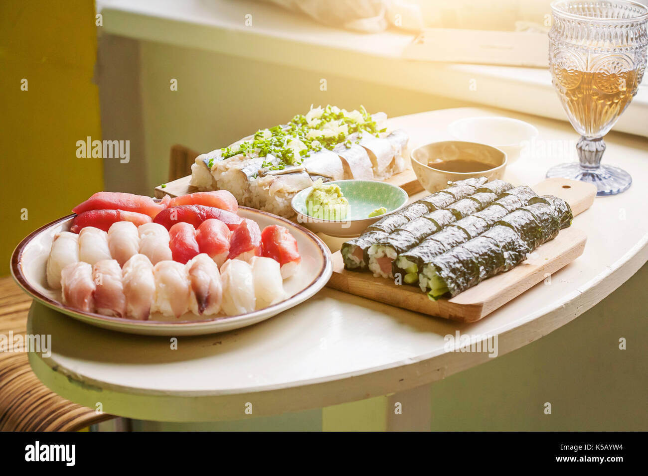 Kitchen table with Japanese sushi Stock Photo - Alamy