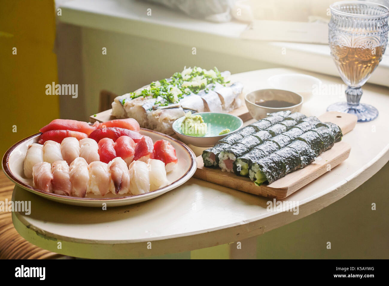 Kitchen table with Japanese sushi Stock Photo - Alamy