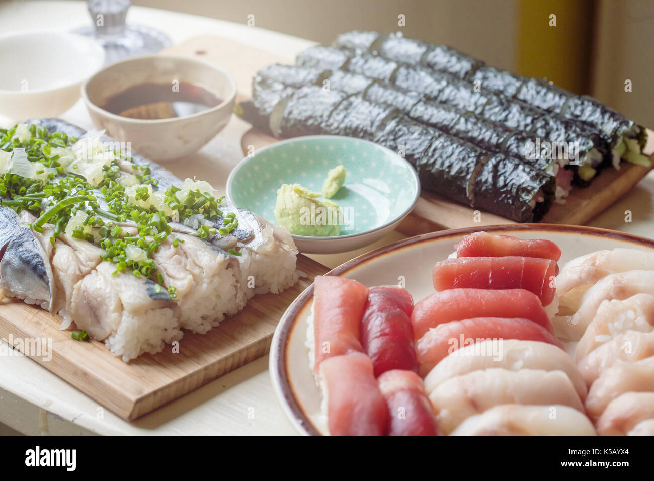 Kitchen table with Japanese sushi Stock Photo - Alamy