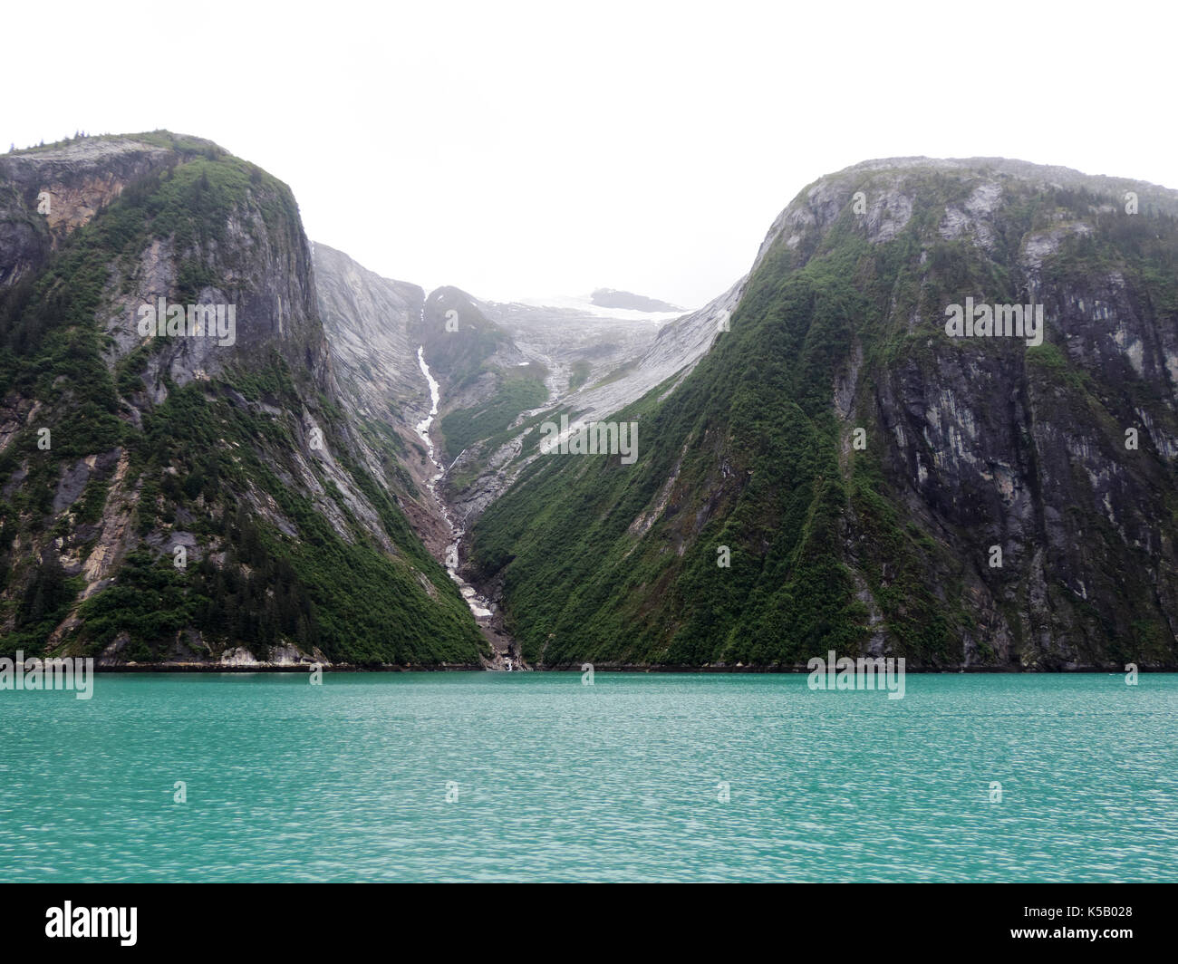 BEAUTIFUL BLUE GLACIAL WATER AND CLIFFS, ALASKA Stock Photo - Alamy