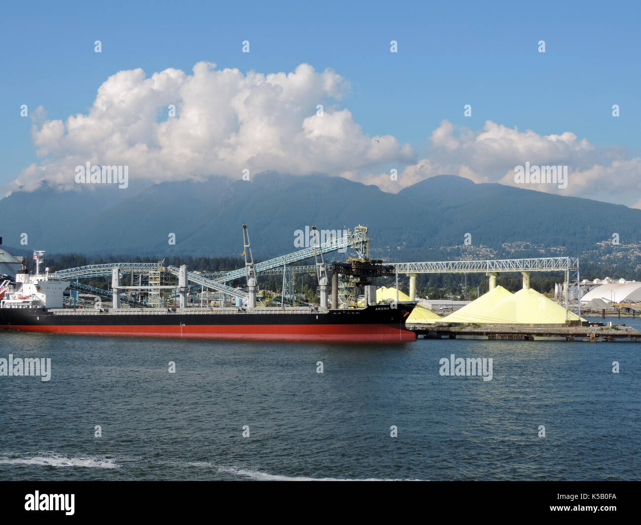 YELLOW STOCK PILES IN SHIPYARD, ALASKA Stock Photo - Alamy