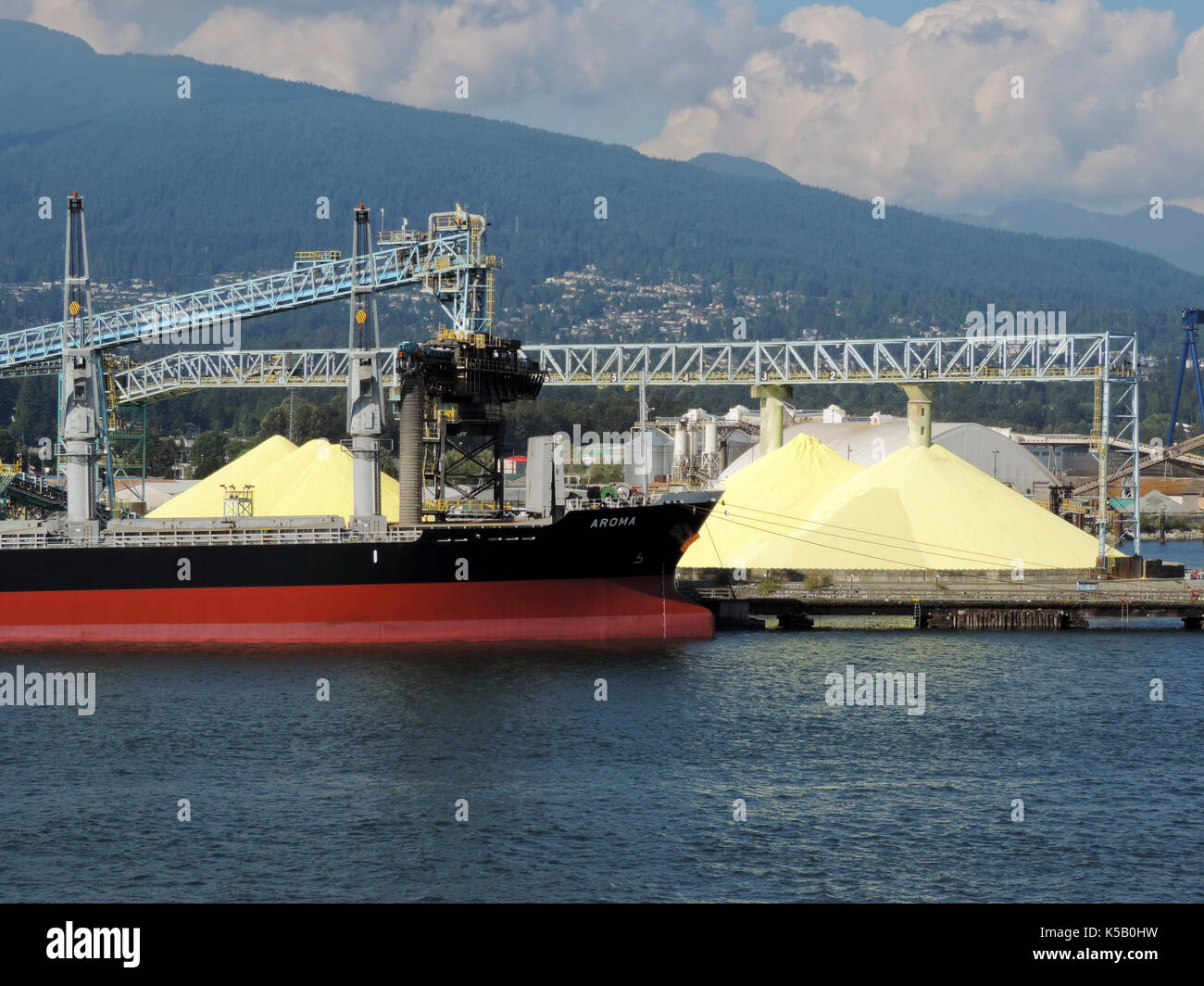 YELLOW STOCK PILES IN SHIPYARD, ALASKA Stock Photo - Alamy