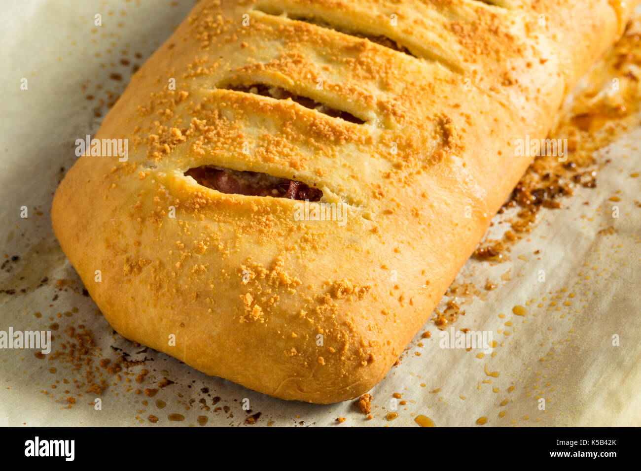 Homemade Cheesy and Meaty Italian Stromboli with Marinara Sauce Stock ...