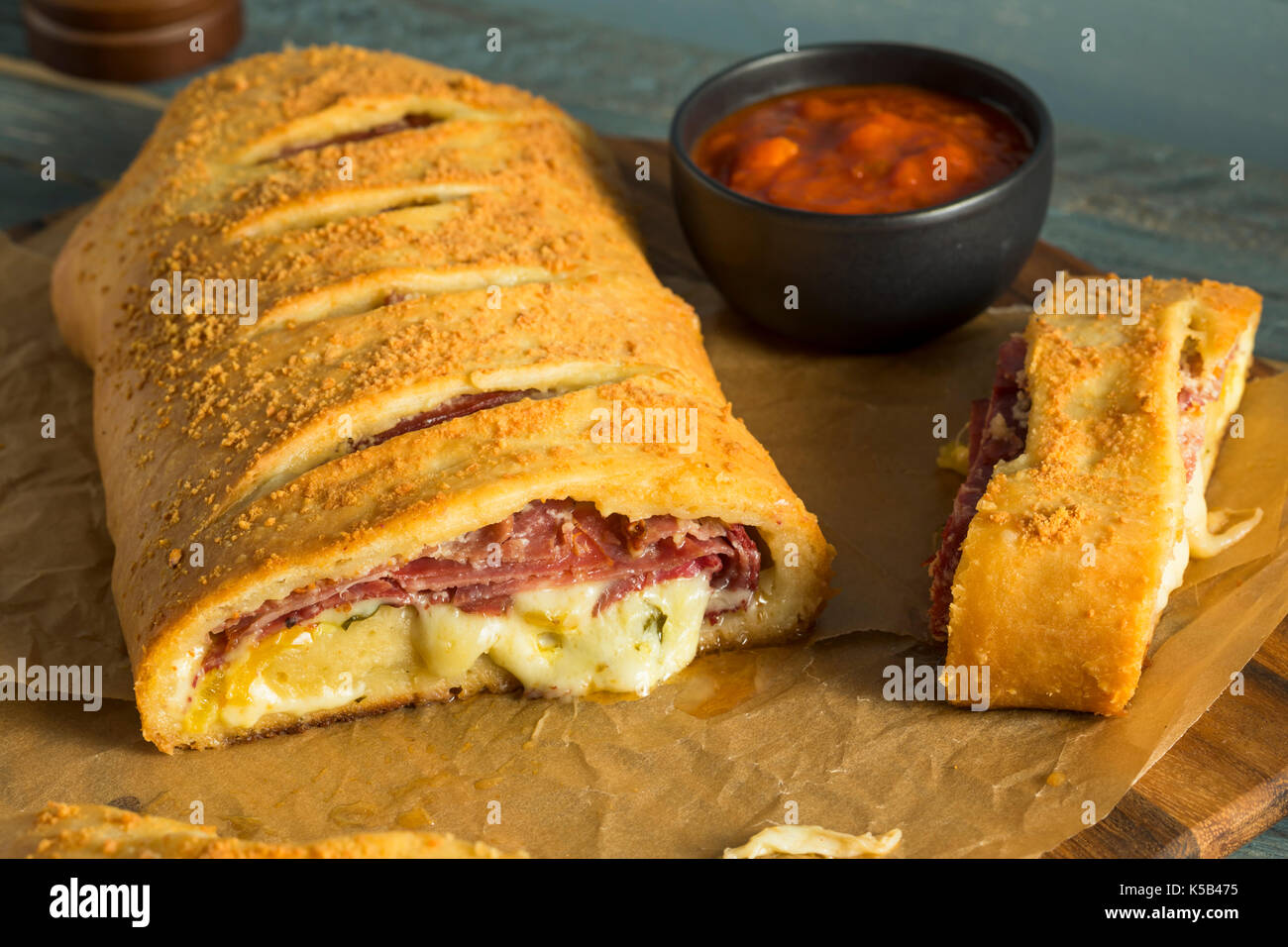 Homemade Cheesy and Meaty Italian Stromboli with Marinara Sauce Stock ...
