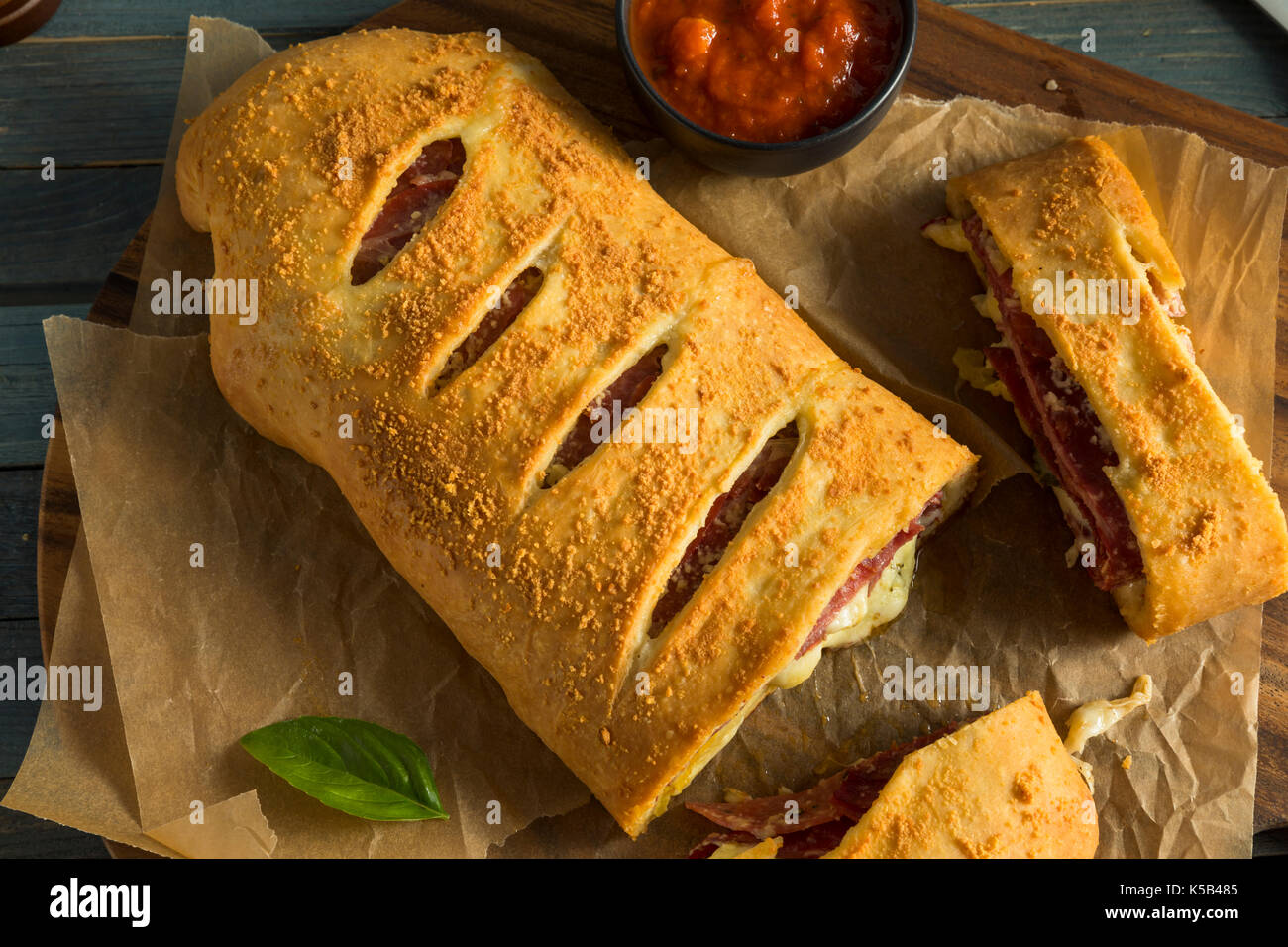 Homemade Cheesy and Meaty Italian Stromboli with Marinara Sauce Stock ...