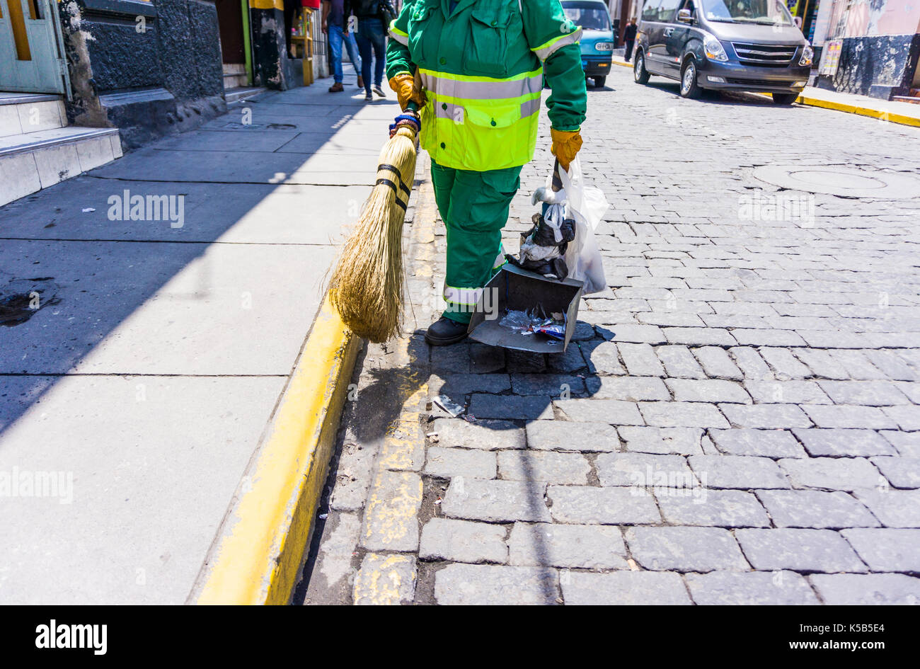 cleaner in the street clean the dirt floor Stock Photo - Alamy