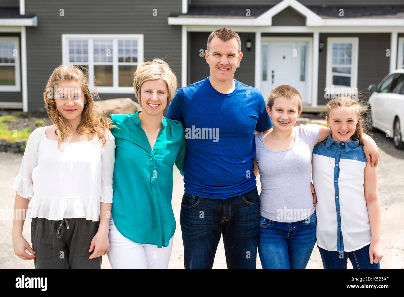 happy family standing in front of the house Stock Photo - Alamy