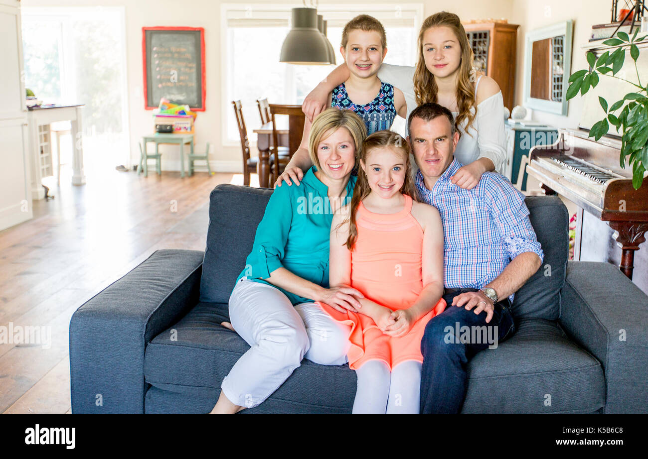 Family couch parents daughter hi-res stock photography and images - Alamy