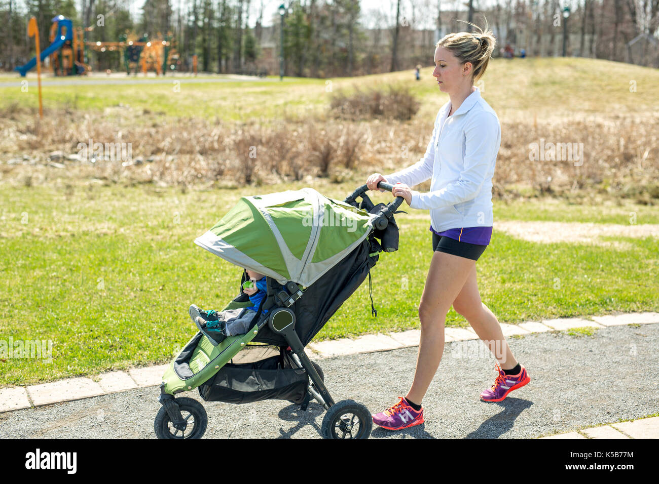 Mother doing Training, jogging with baby Stock Photo - Alamy
