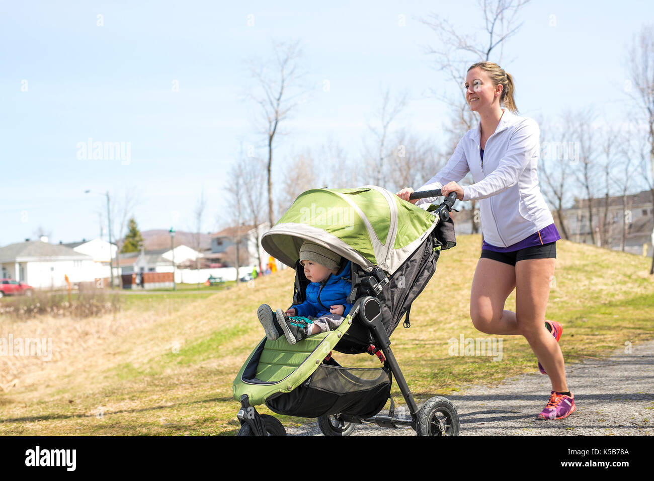 Mother doing Training, jogging with baby Stock Photo - Alamy