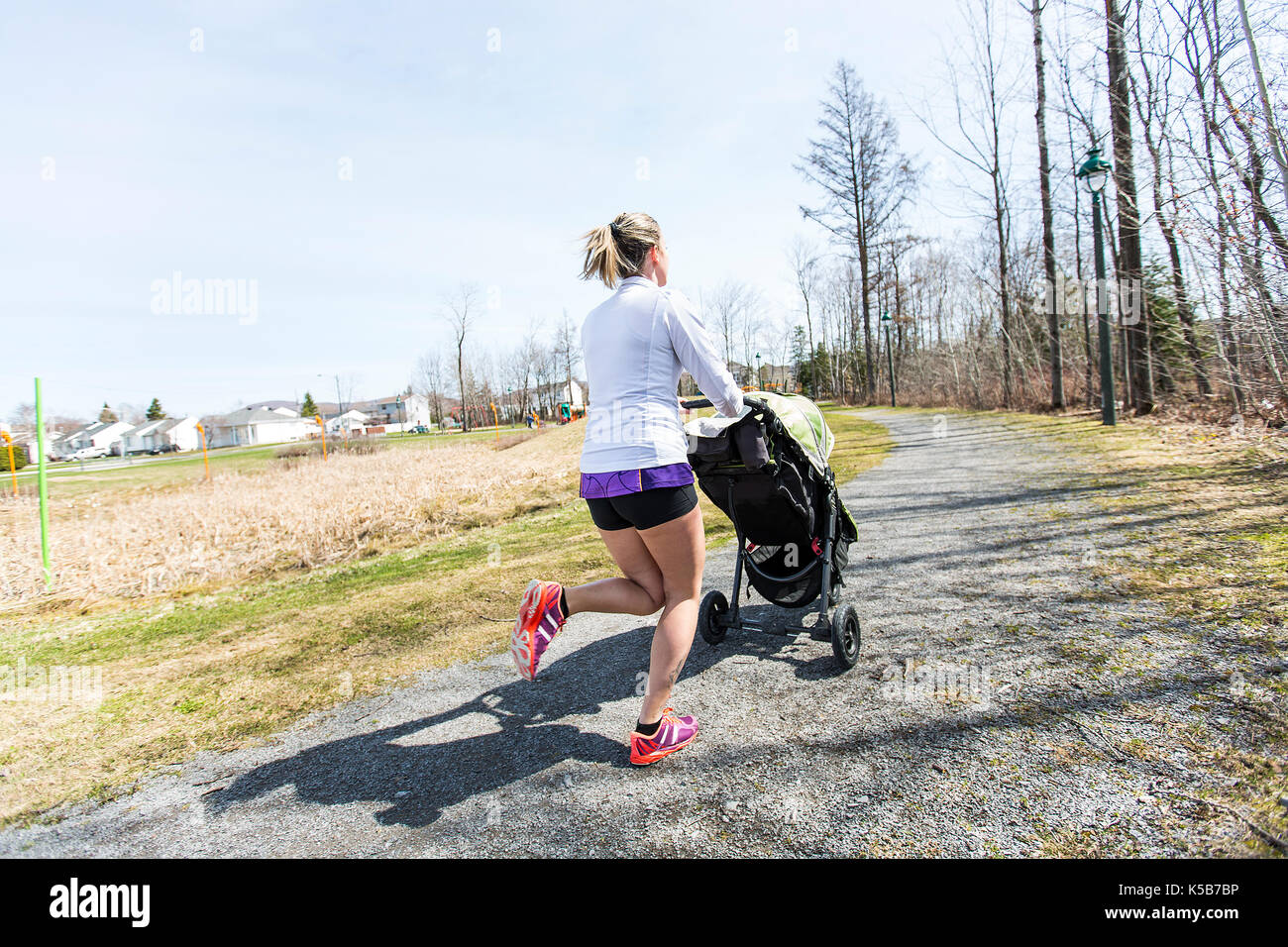 Mother doing Training, jogging with baby Stock Photo - Alamy