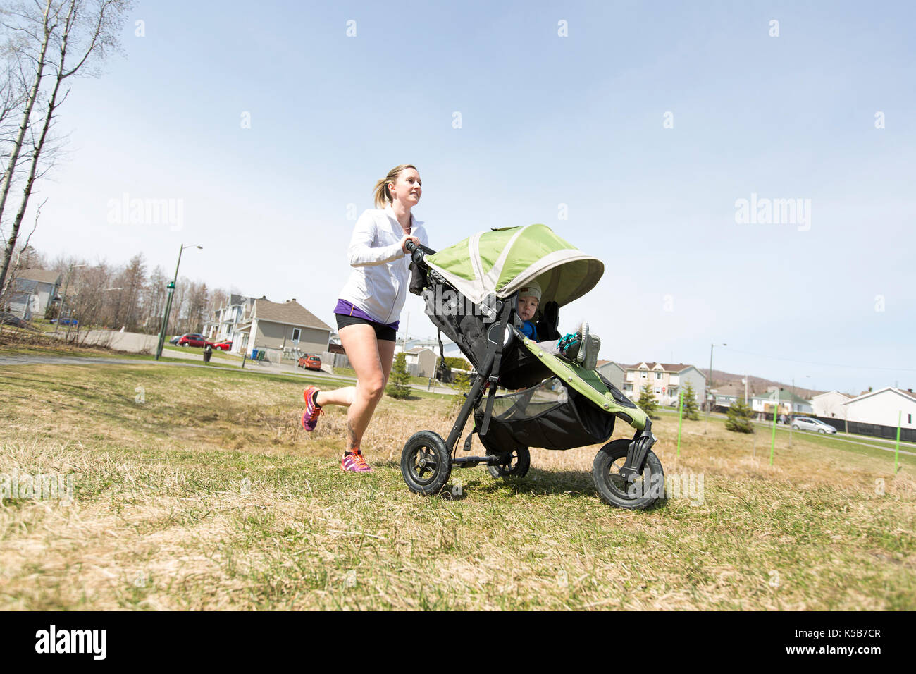 Mother doing Training, jogging with baby Stock Photo - Alamy