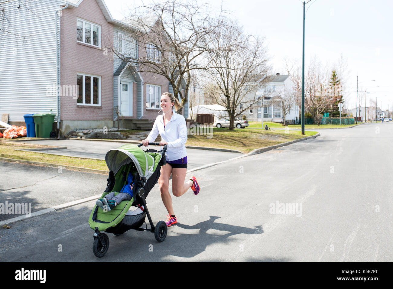 Mother doing Training, jogging with baby Stock Photo - Alamy