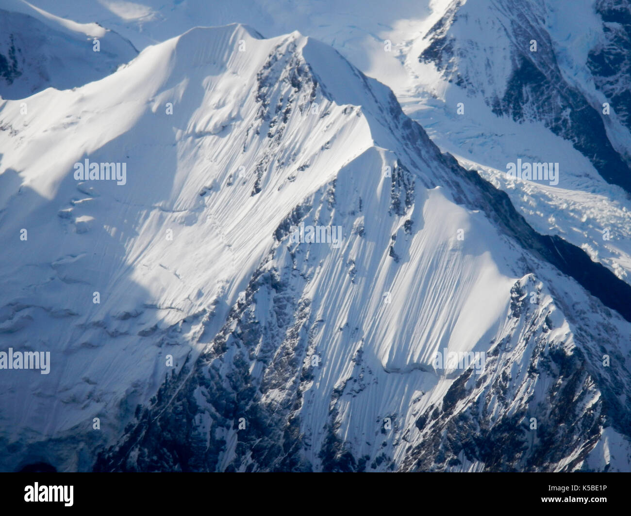 AERIAL VIEW OF SNOW CAPPED MOUNTAINS, ALASKA Stock Photo - Alamy