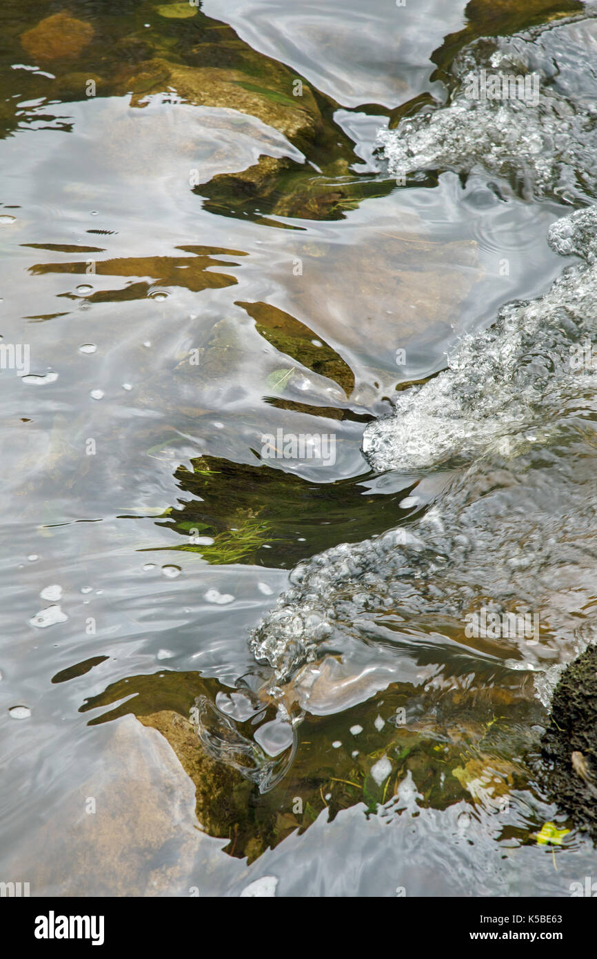 River flowing over rocks Stock Photo - Alamy