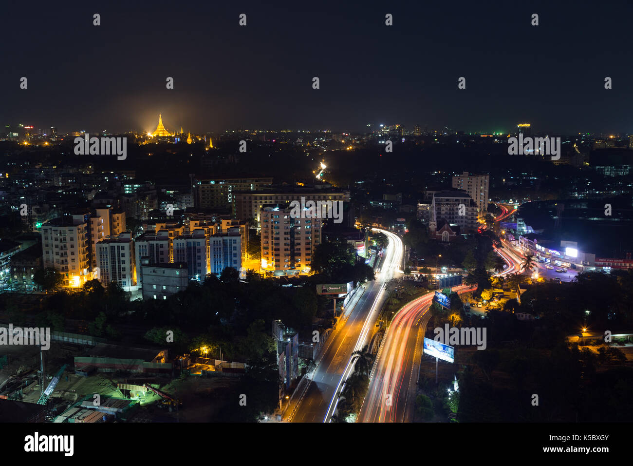 View of Yangon, Myanmar, from above in the evening. Lit Shwedagon ...