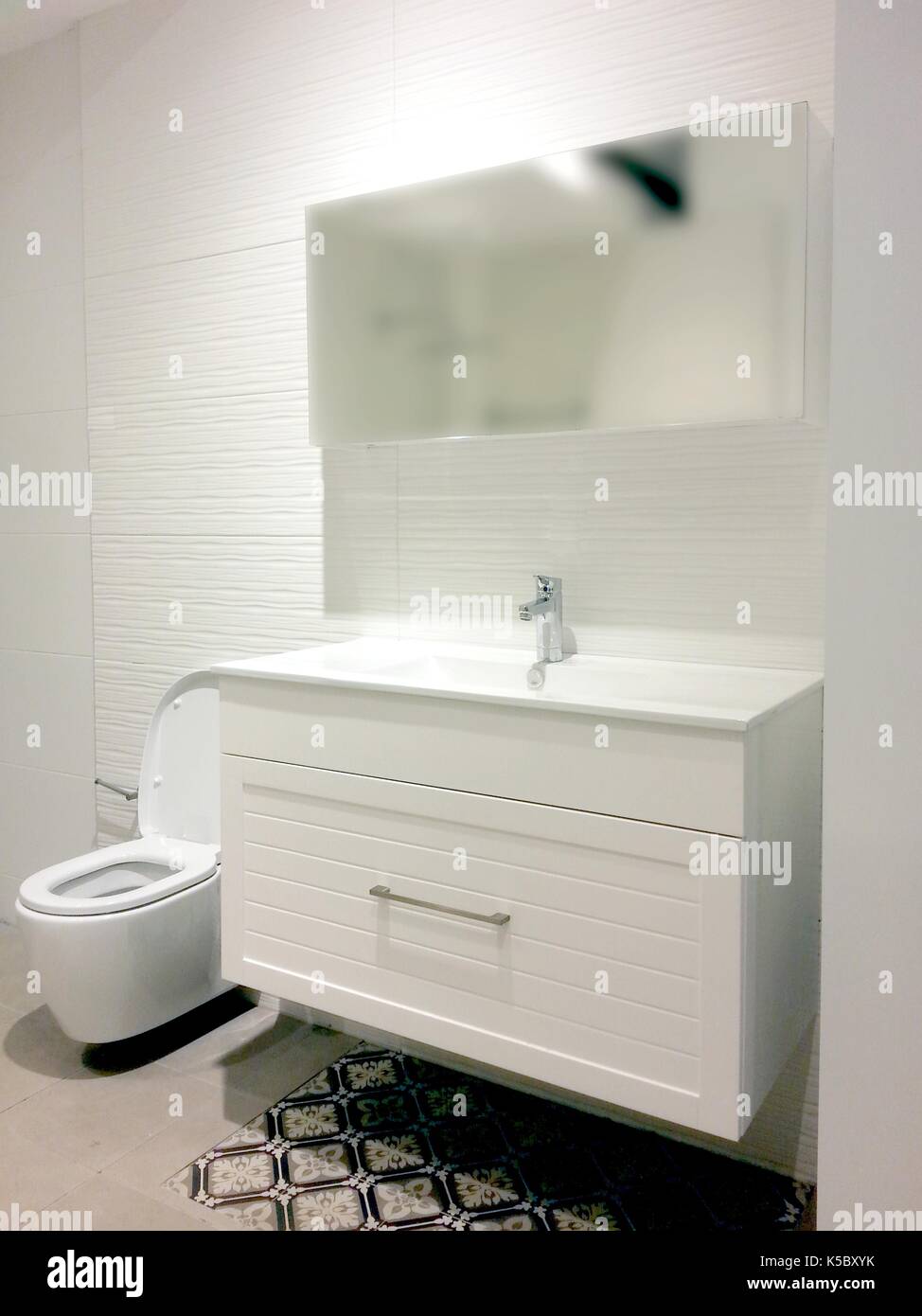 Modern bright bathroom design with a toilet Stock Photo - Alamy