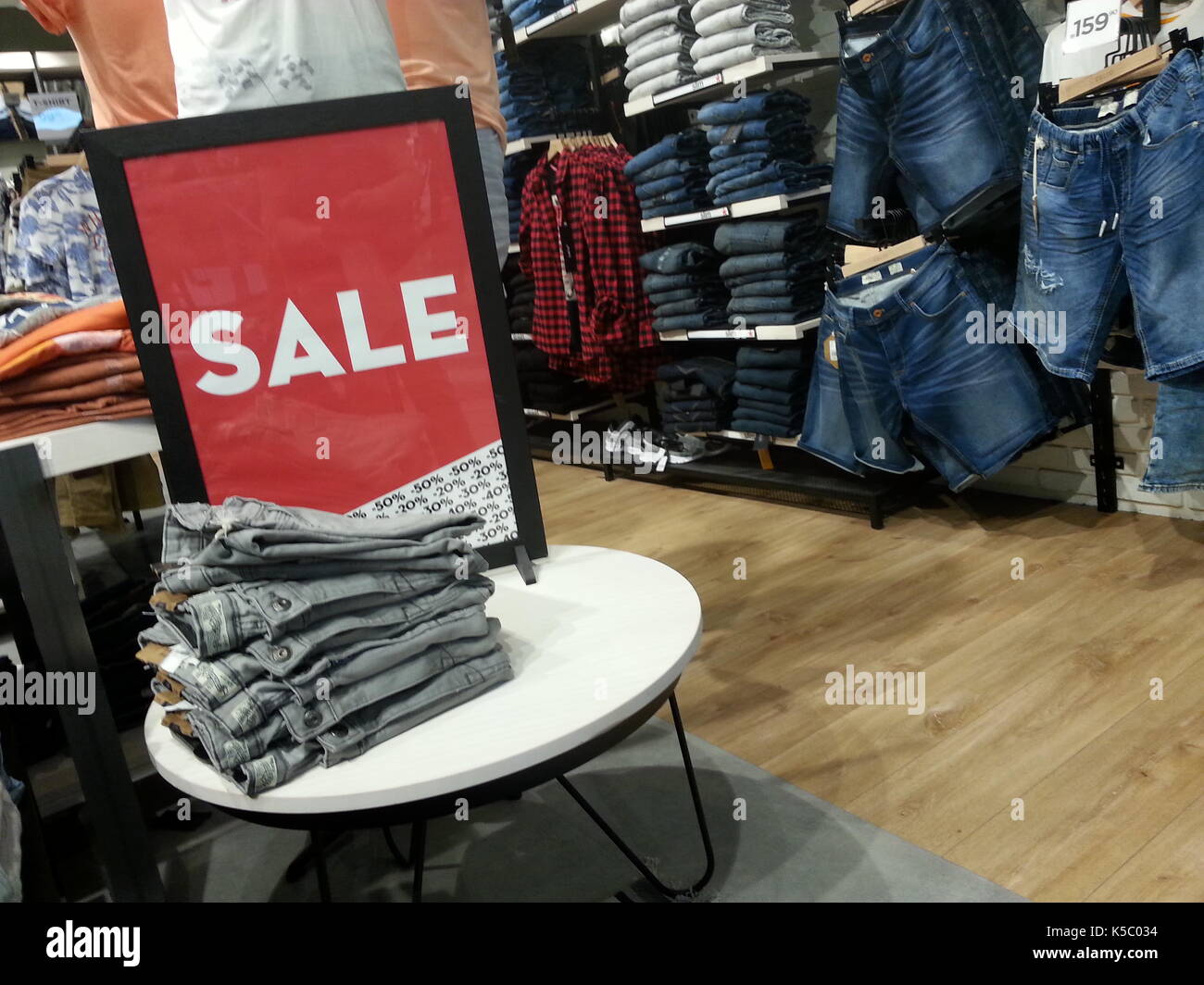 Shop sale window display dummy clothes faceless Stock Photo - Alamy