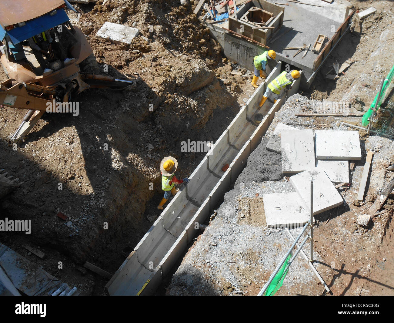 SELANGOR, MALAYSIA -MARCH 18, 2017: Construction workers install ...
