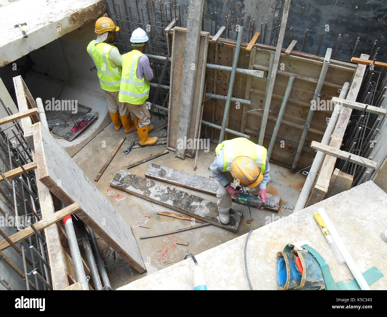 SELANGOR, MALAYSIA -MARCH 18, 2017: Construction workers install ...
