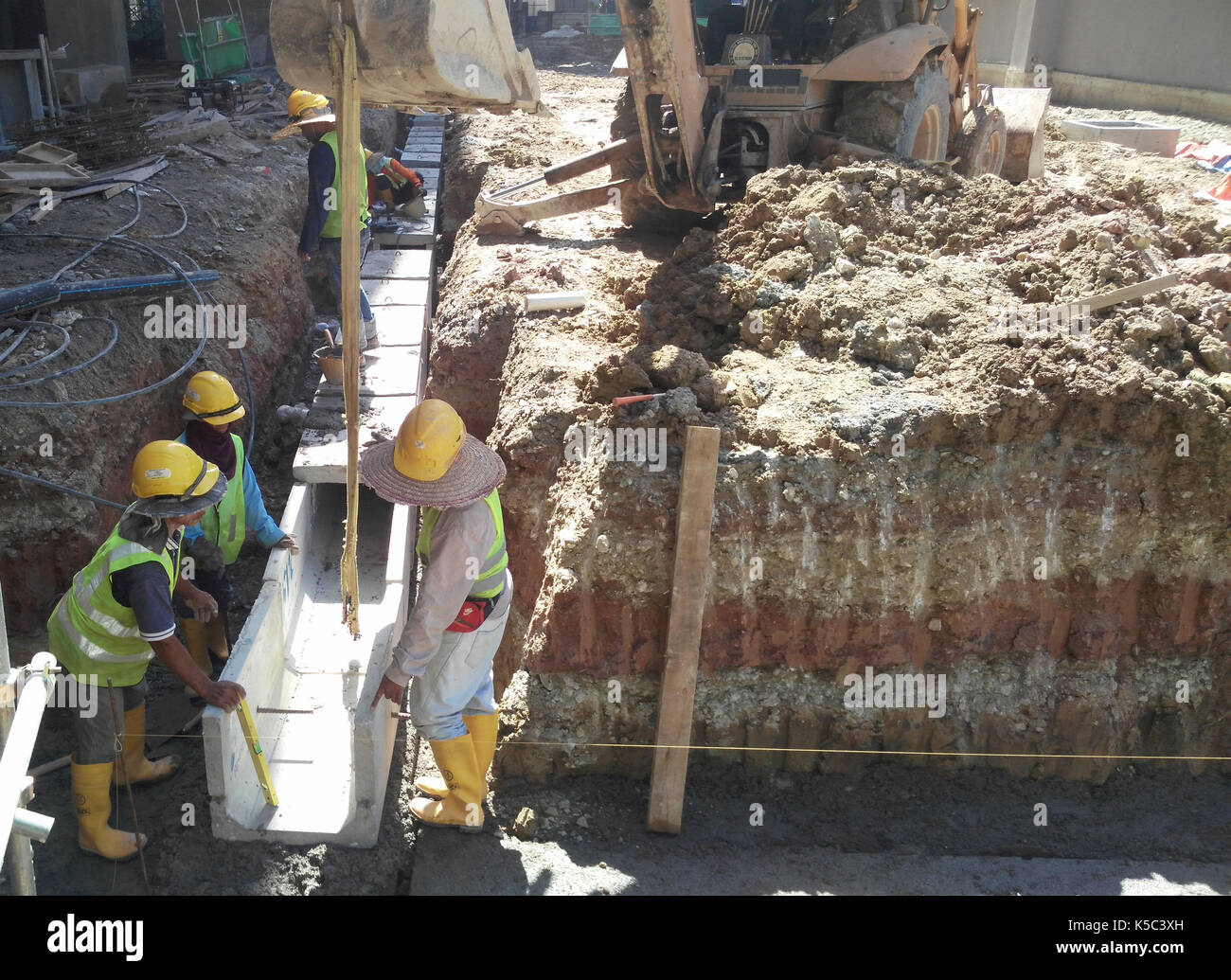 SELANGOR, MALAYSIA -MARCH 18, 2017: Construction workers install ...