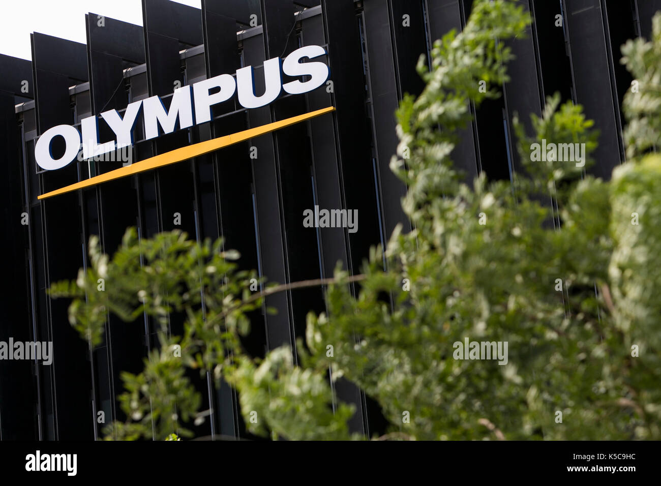 A logo sign outside of a facility occupied by the Olympus Corporation ...