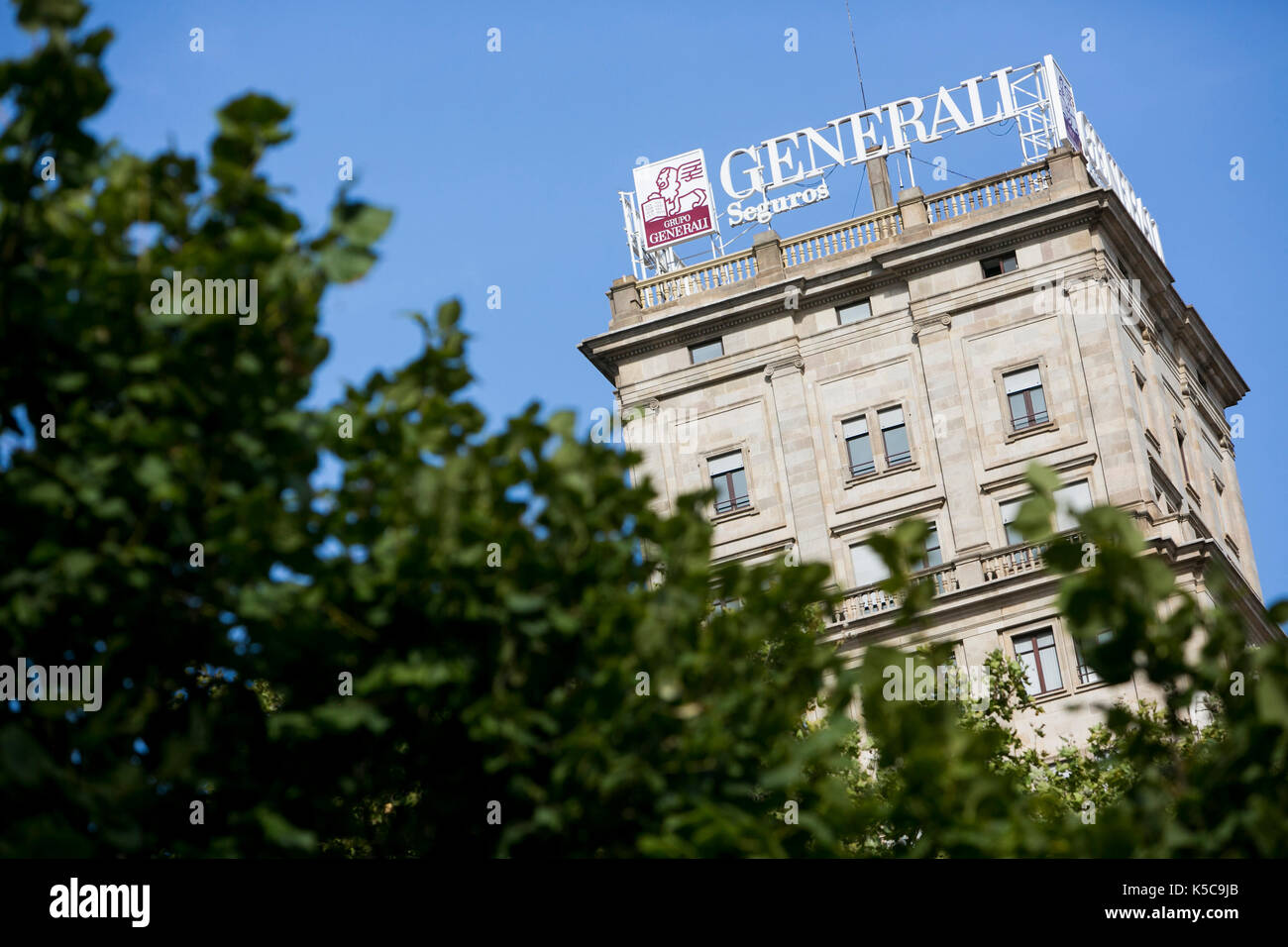 A logo sign outside of a facility occupied by the Generali Group in ...