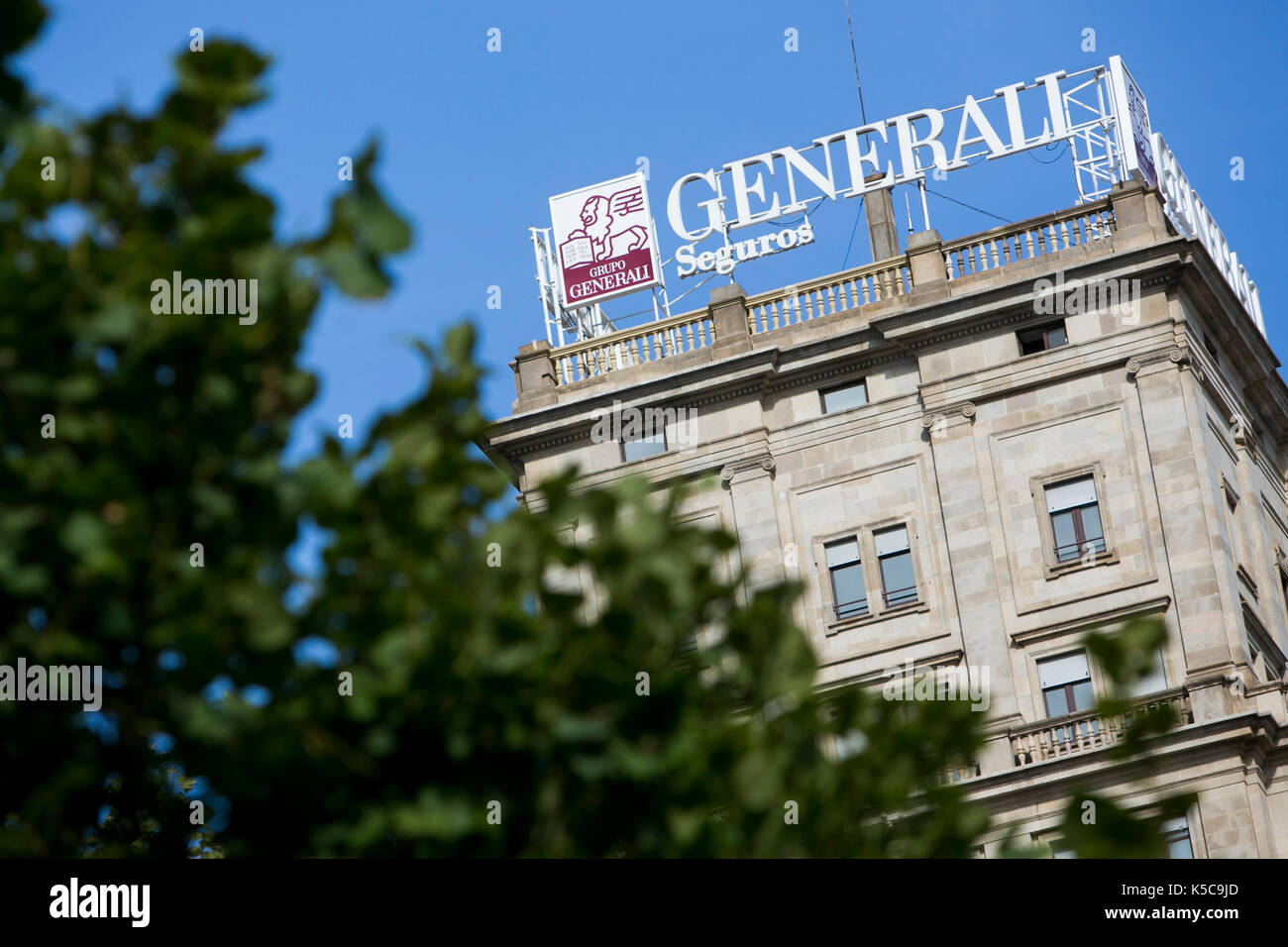 A logo sign outside of a facility occupied by the Generali Group in ...