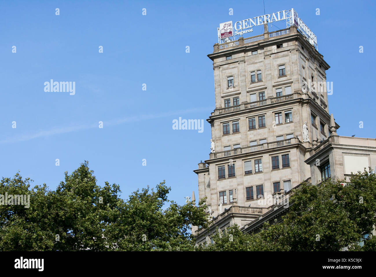 A logo sign outside of a facility occupied by the Generali Group in ...