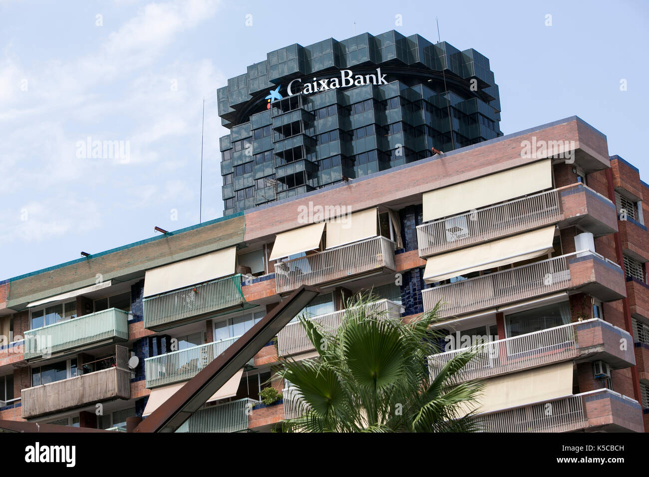 A logo sign outside of the headquarters of the La Caixa group and Caixa ...