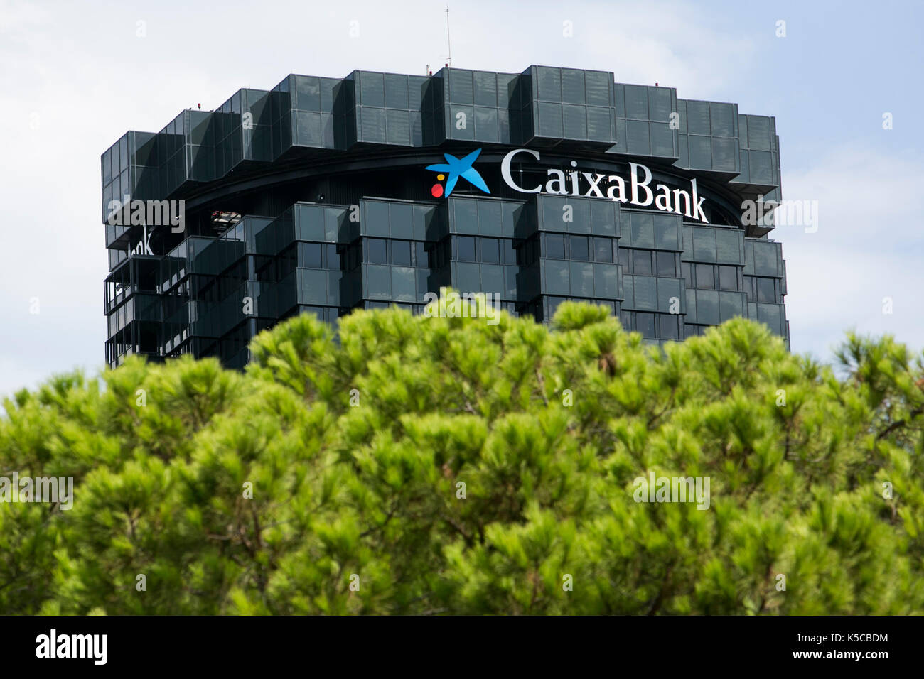 A logo sign outside of the headquarters of the La Caixa group and Caixa ...