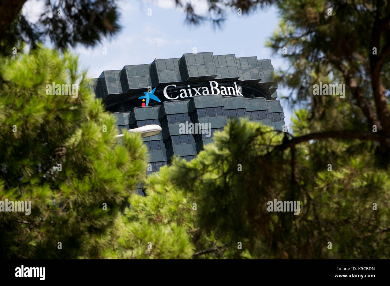 A logo sign outside of the headquarters of the La Caixa group and Caixa ...