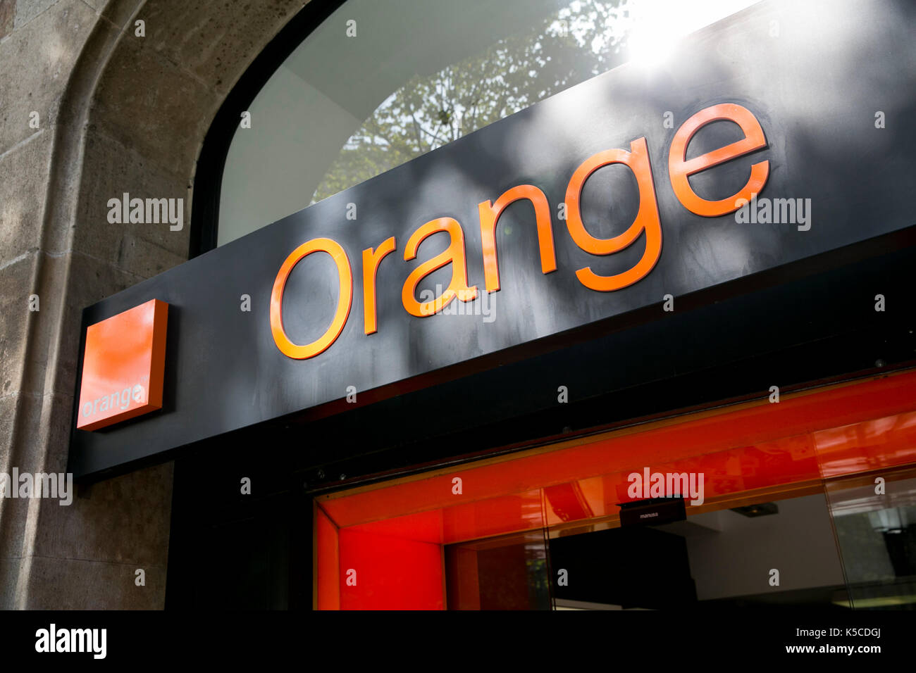 A logo sign outside of a Orange S.A., retail store in Barcelona, Spain ...