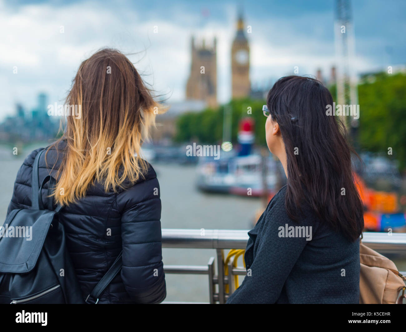 Two girls on a sightseeing trip to London Stock Photo - Alamy