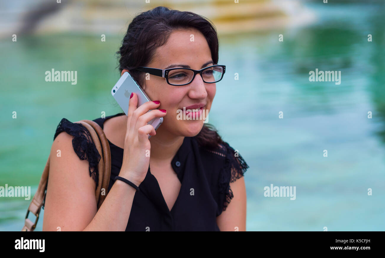 Young Turkish girl is taking a phone call Stock Photo - Alamy